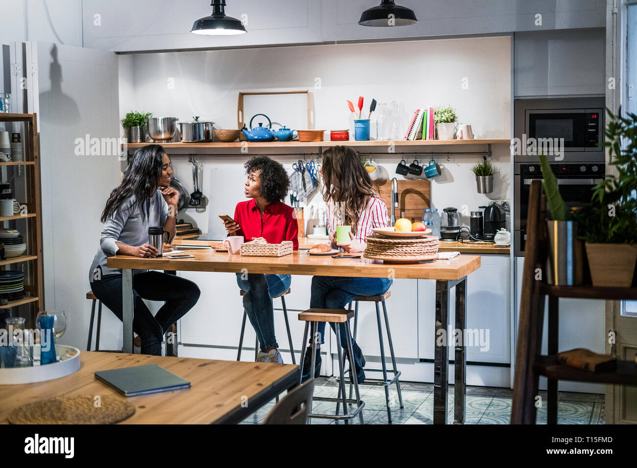 Three friends at home, living together Stock Photo - Alamy