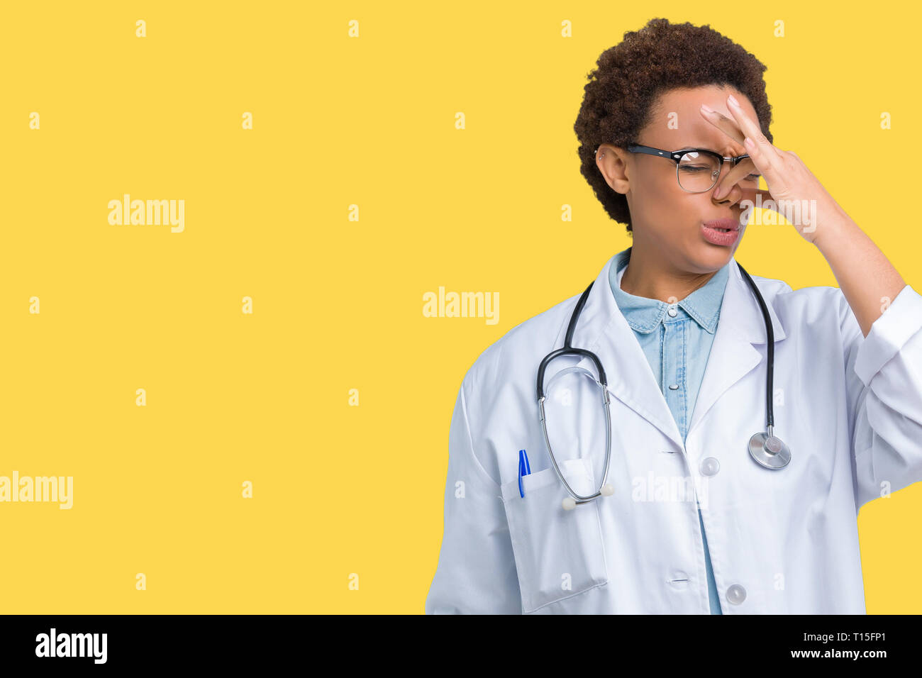 Young african american doctor woman wearing medical coat over isolated ...