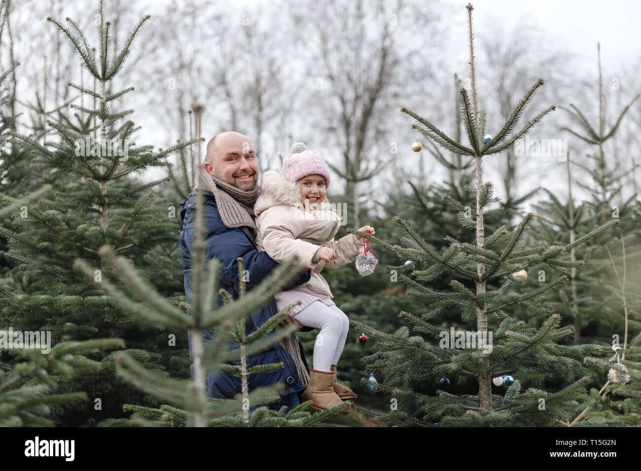 Father christmas by tree hi-res stock photography and images - Alamy
