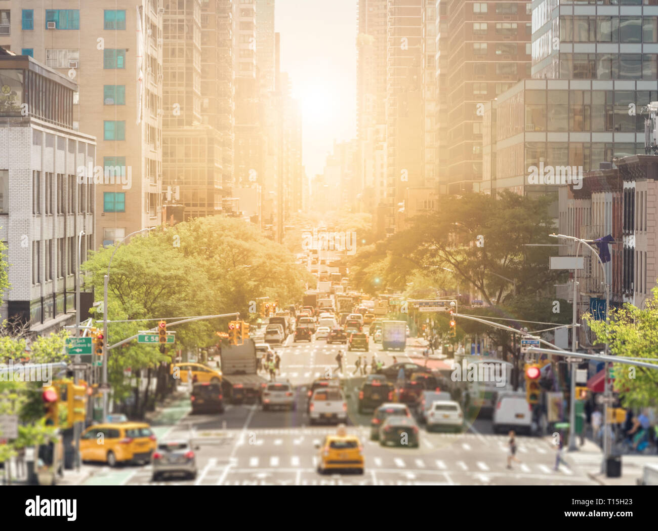 View of Second Avenue in New York city is crowded with cars and people ...