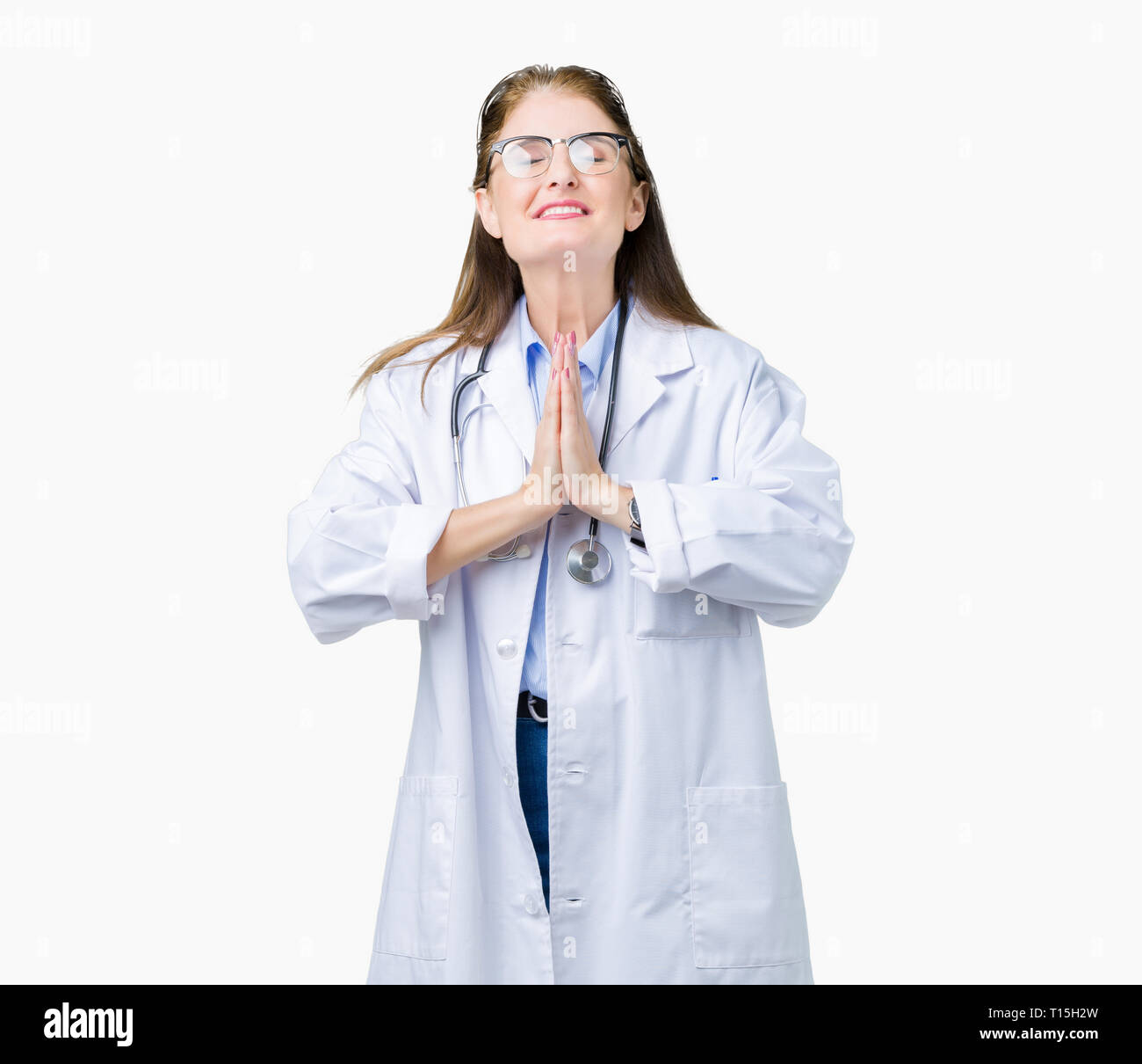 Middle age mature doctor woman wearing medical coat over isolated ...