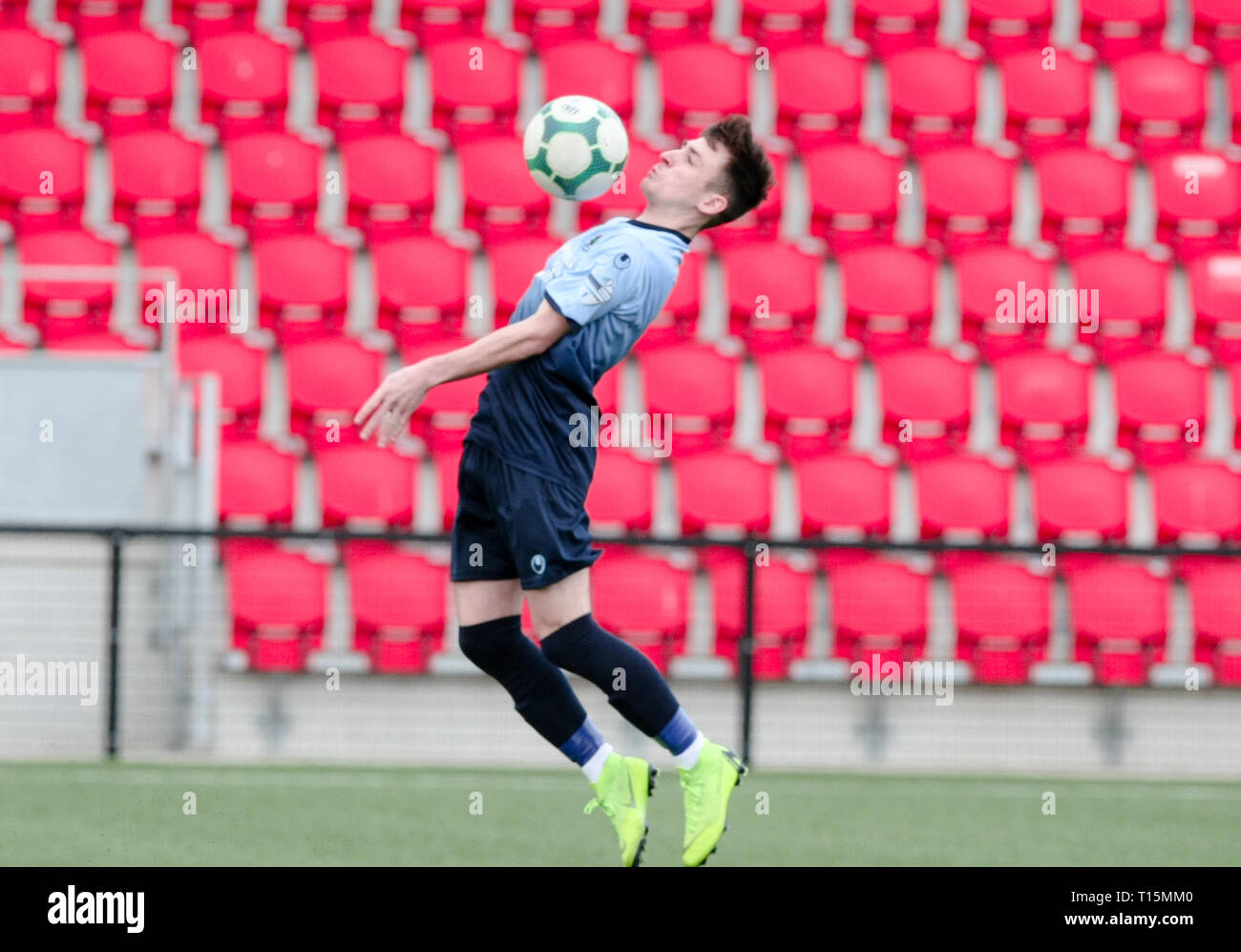 Derry, Northern Ireland, UK. Jamie Dunne controls a high ball during ...