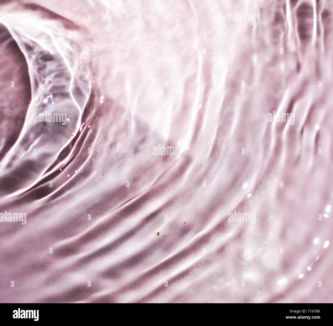 Pink flowing water texture as an abstract background - colourful ...