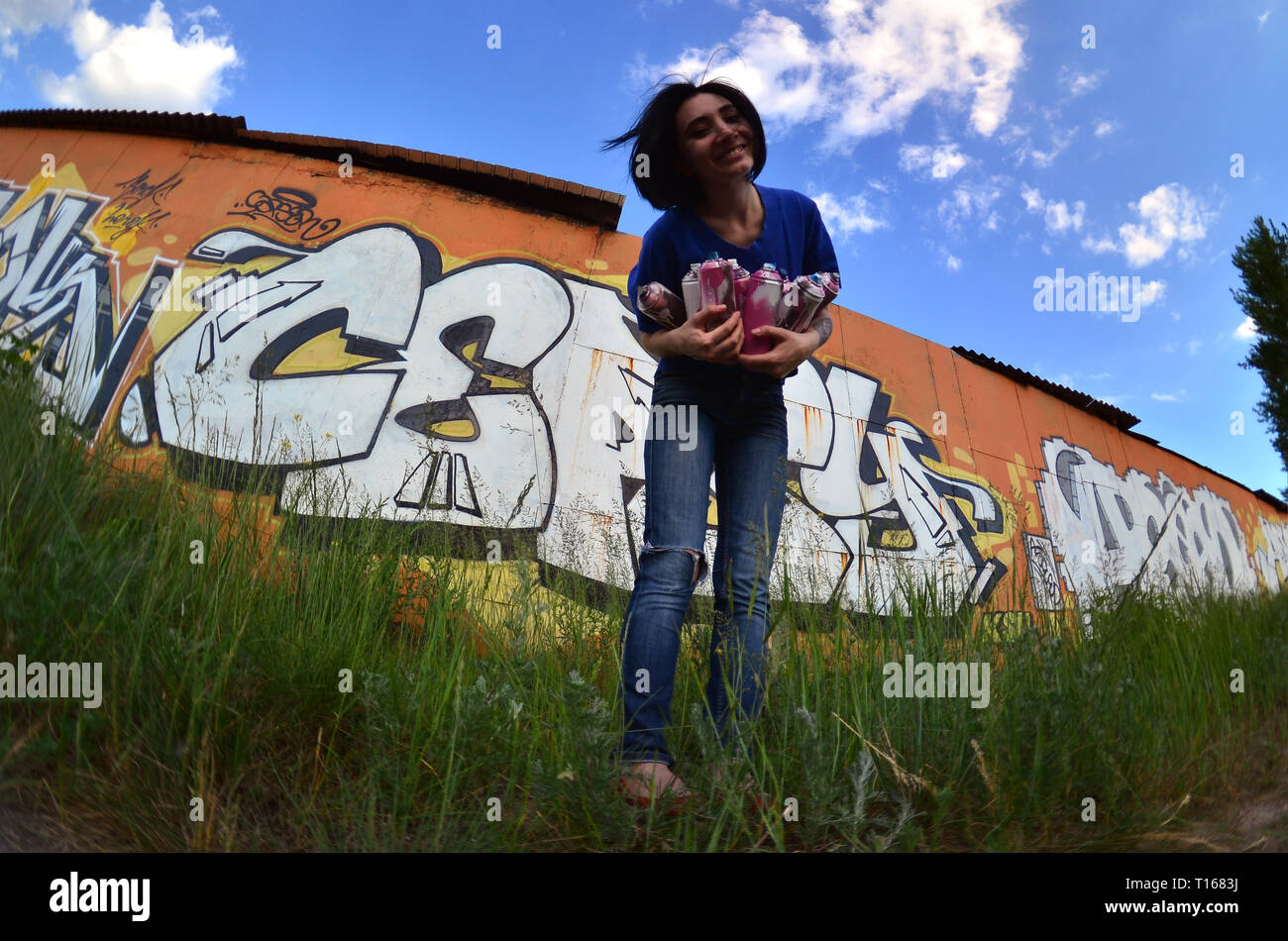 Graffiti artist hands paint cans hi-res stock photography and images ...