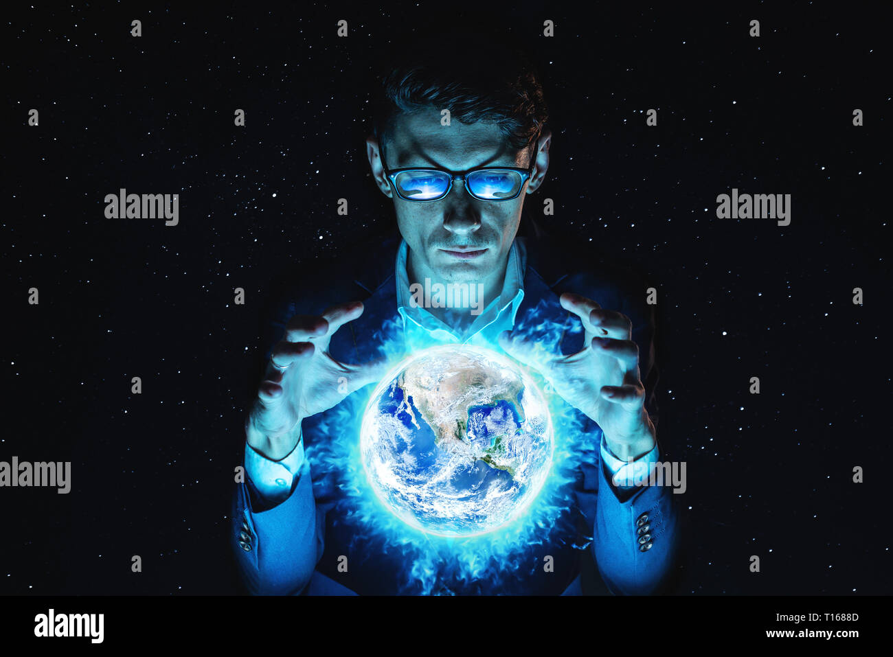 Man holding blue sphere hi-res stock photography and images - Alamy