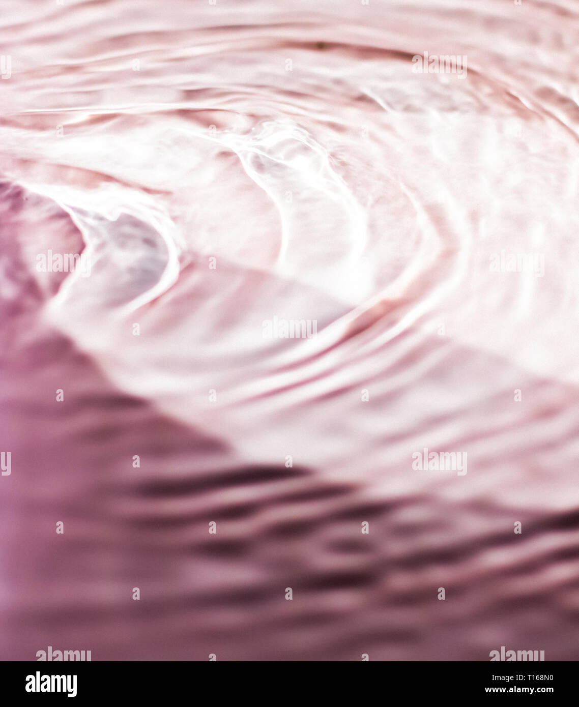 Pink flowing water texture as an abstract background - colourful ...