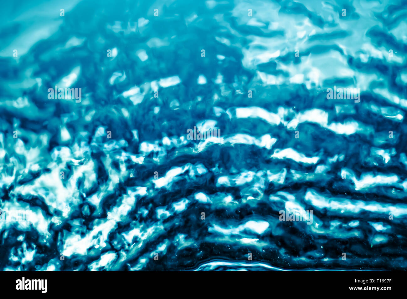 Abstract blue liquid surface as background - futuristic design and ...