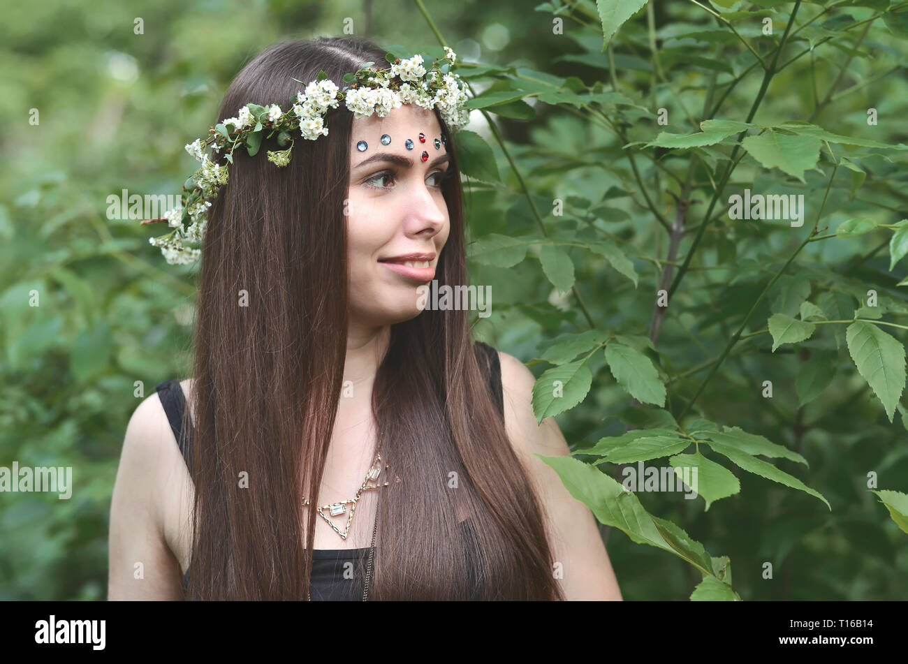 A Forest Picture Of A Beautiful Young Brunette Of European Appearance