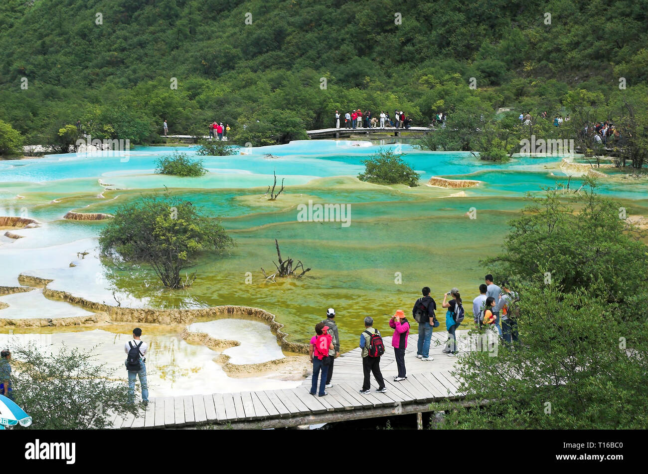 Huanglong China Sep 7 2006, landscape with tourists admiring the multi ...