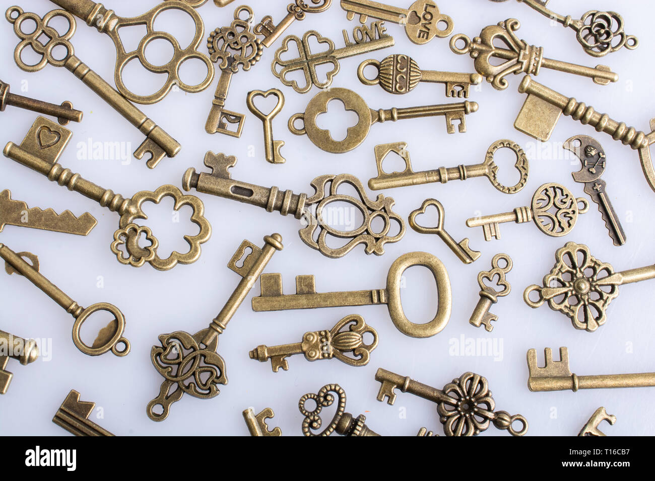 Retro style metal keys on a white background Stock Photo - Alamy