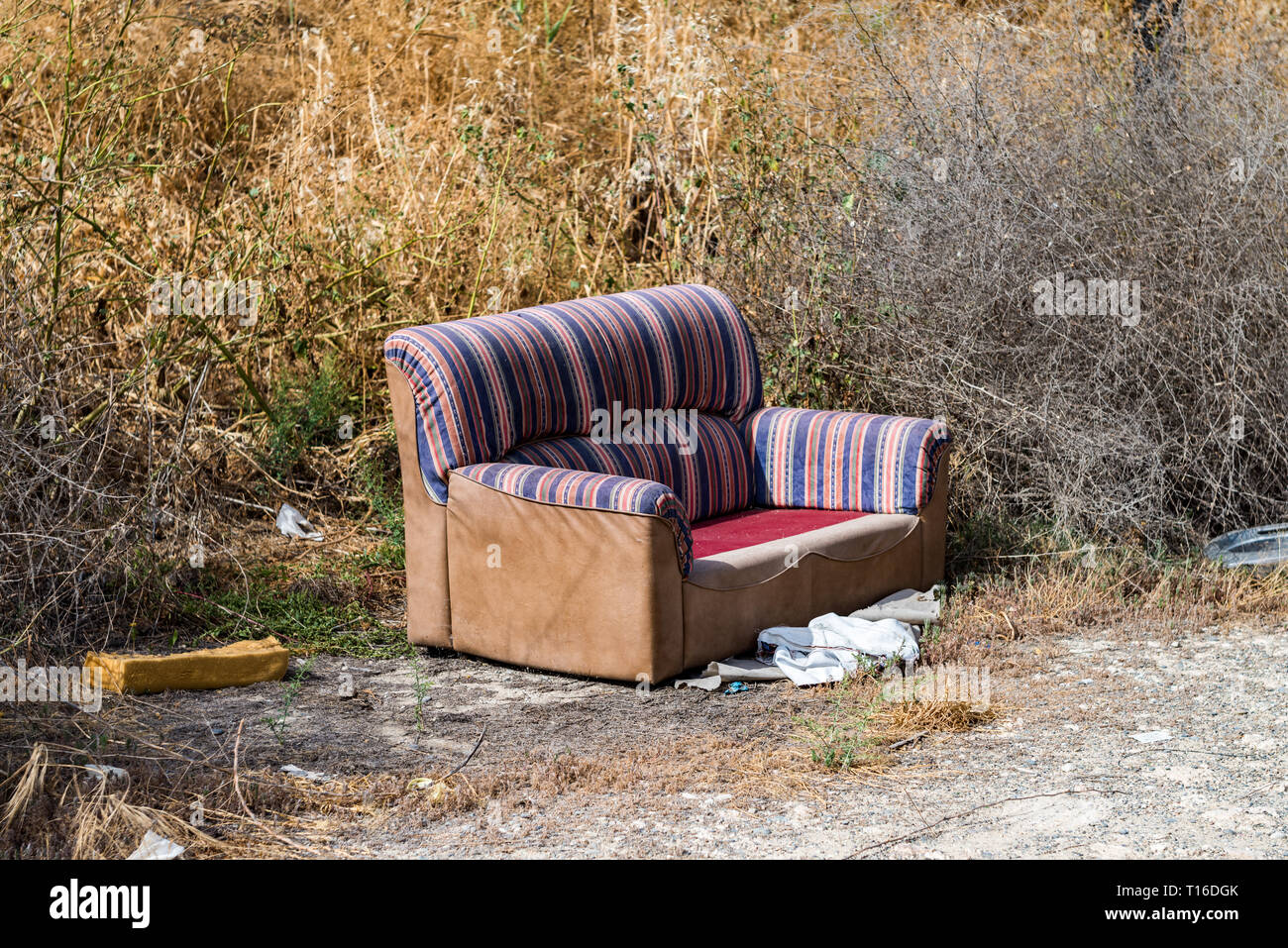 Sofa thrown away in natural area - forest part - illegal dumping trash ...