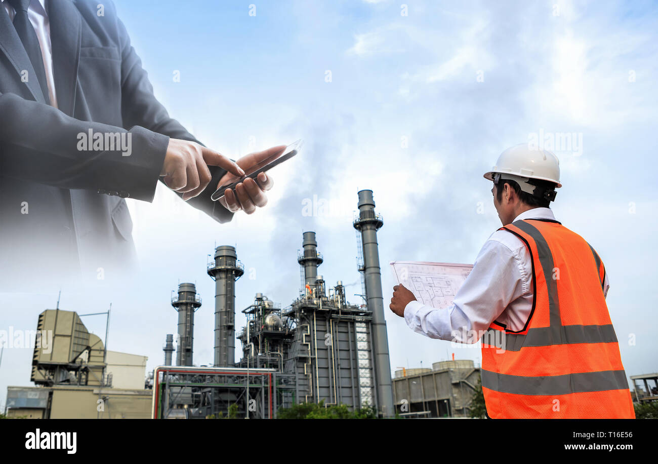 businessman is used smart phone control engineering at power plant It ...