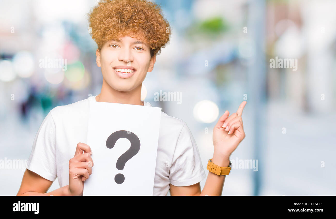 Young arab man showing paper hi-res stock photography and images - Alamy