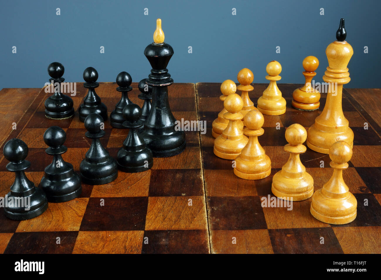 Leader vs boss or manager. Chess kings and pawns on desk Stock Photo ...