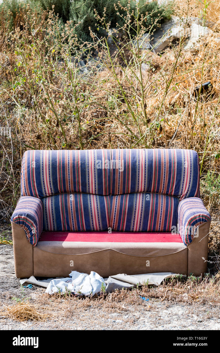 Sofa thrown away in natural area - forest part - illegal dumping trash ...