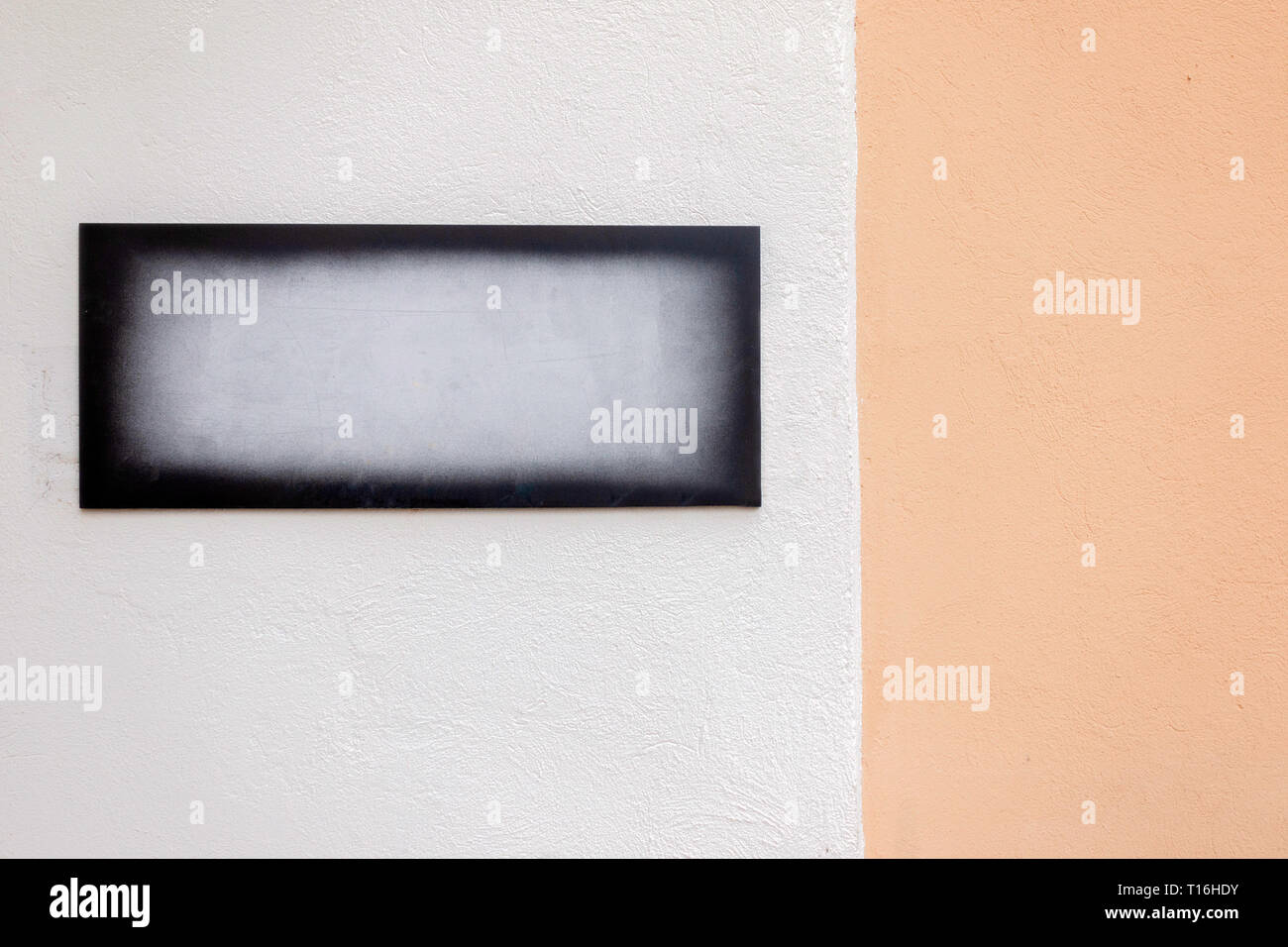 Mock up. Blank empty rectangle shape signboard on the building wall ...