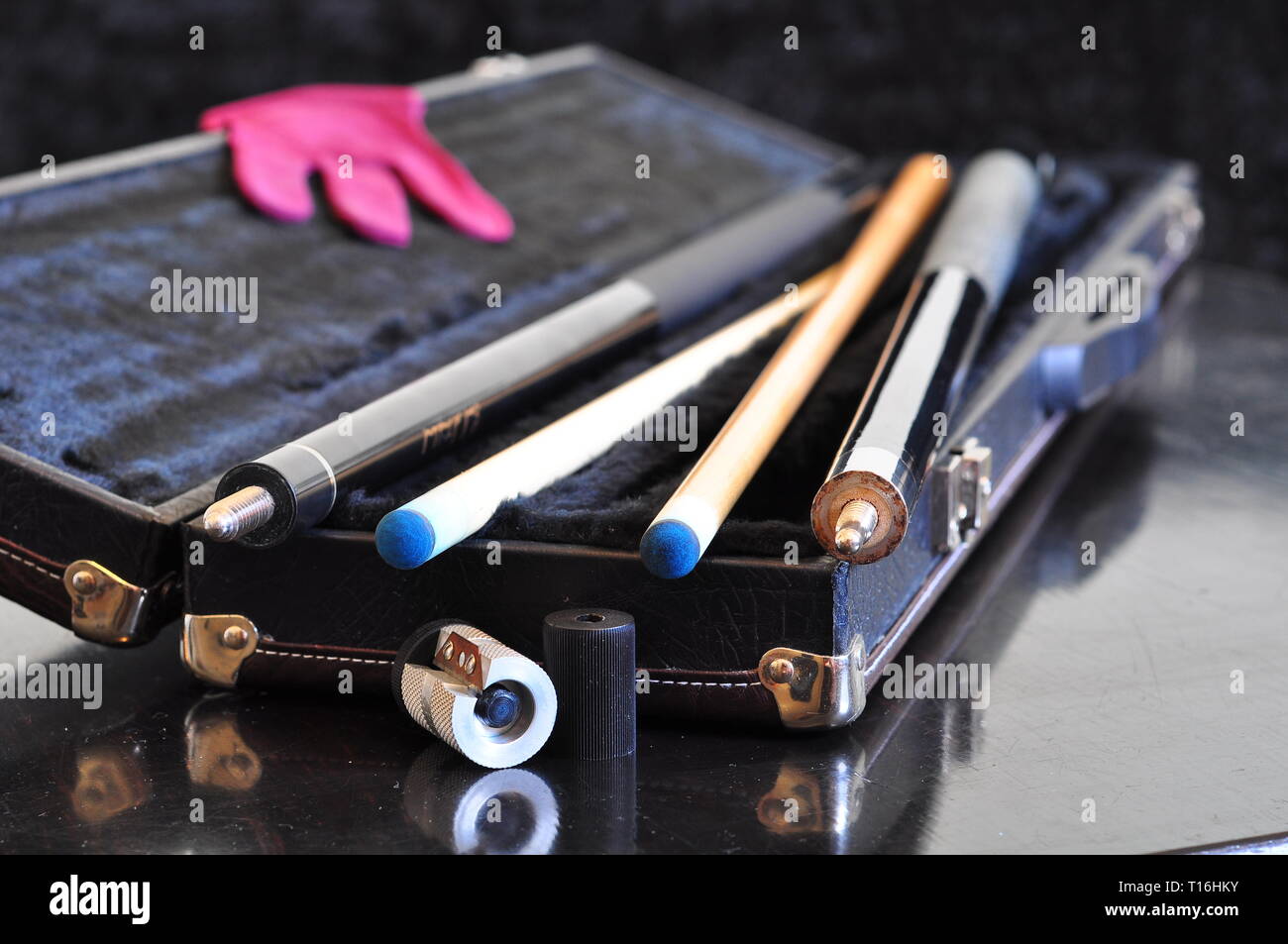 Open trunk cue case and the cues for the game of pool Stock Photo - Alamy