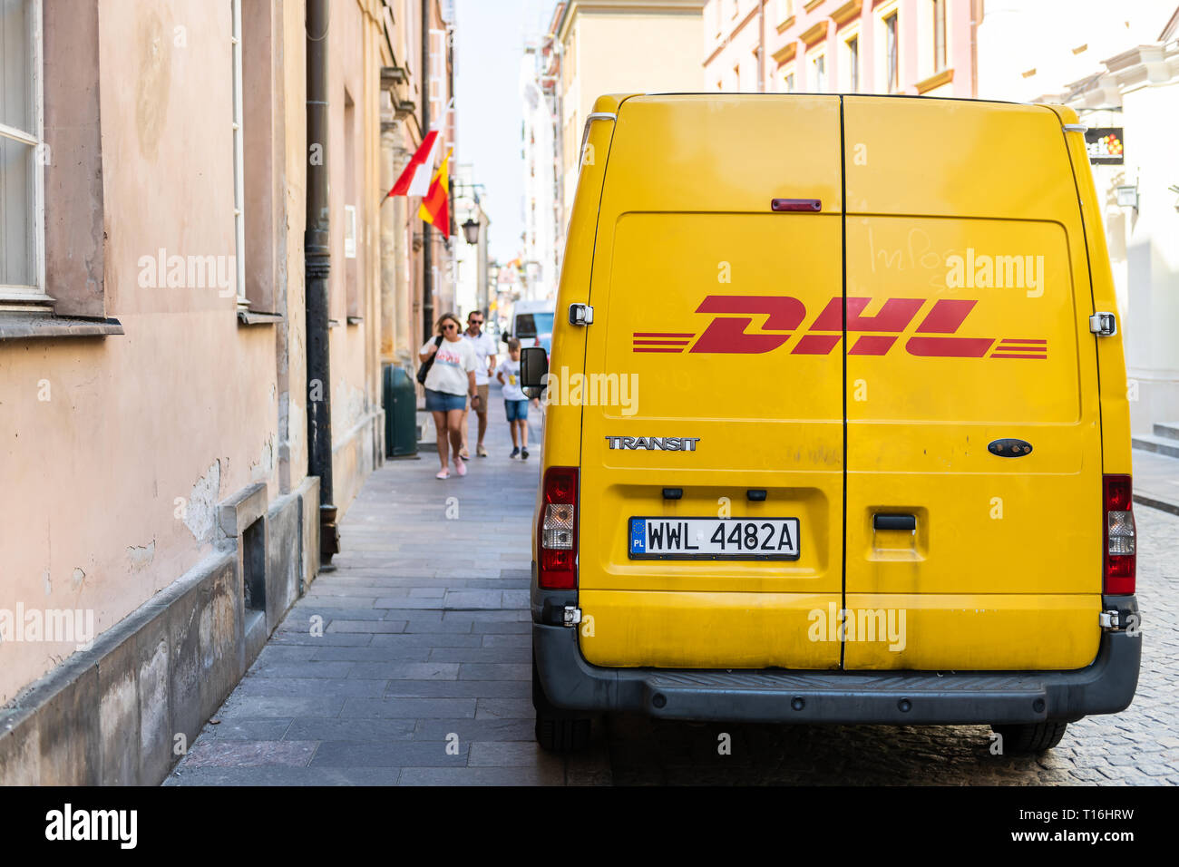 Warsaw, Poland - August 23, 2018: Old town street with closeup of DHL ...