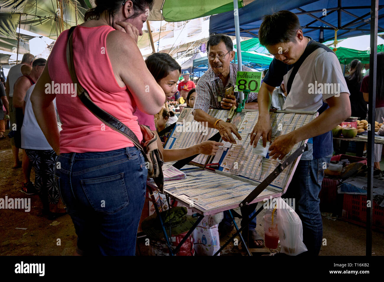 Thailand lottery. People buying lottery tickets from a Thai lottery ...