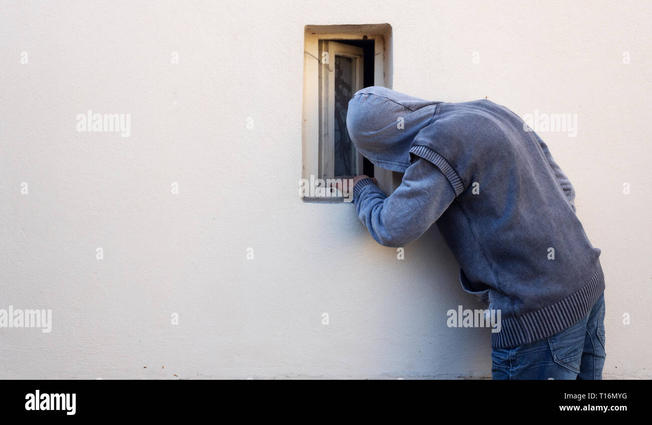 Burglar Looking Through Window High Resolution Stock Photography and ...