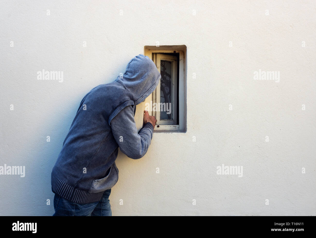 Burglar Looking Through Window High Resolution Stock Photography and ...