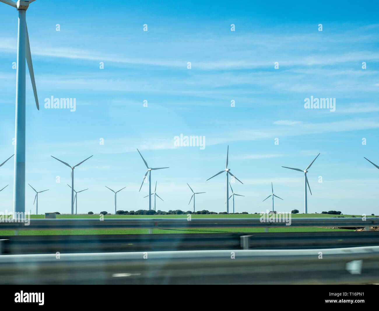 Pictures of wind energy mills from a car on the motorway Stock Photo ...