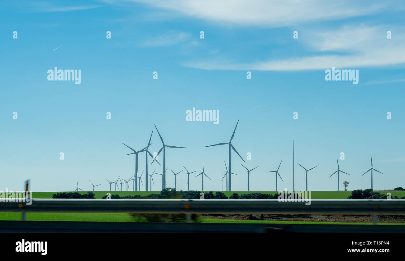 Pictures of wind energy mills from a car on the motorway Stock Photo ...