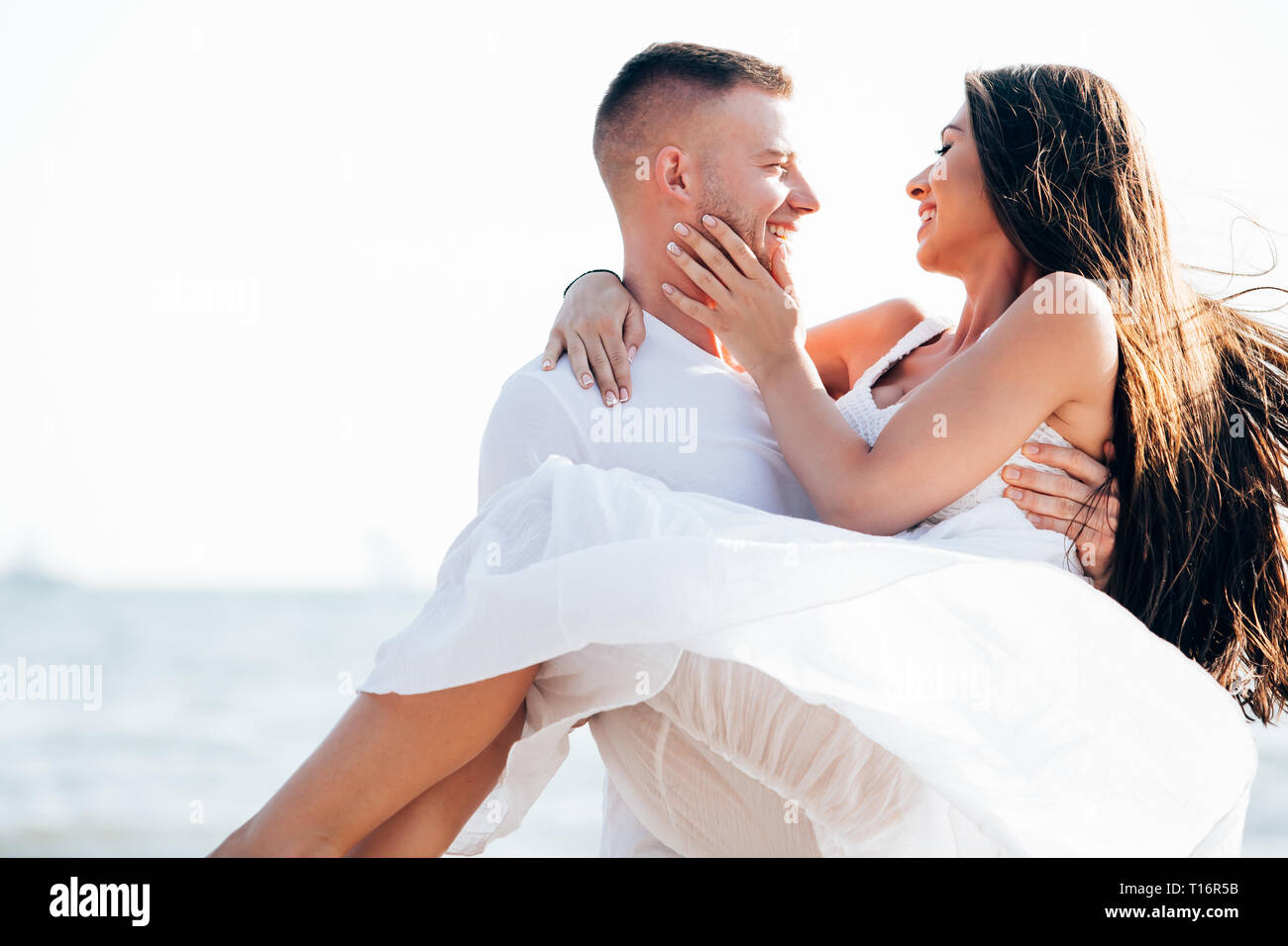 Man Lifts Woman High Resolution Stock Photography and Images - Alamy