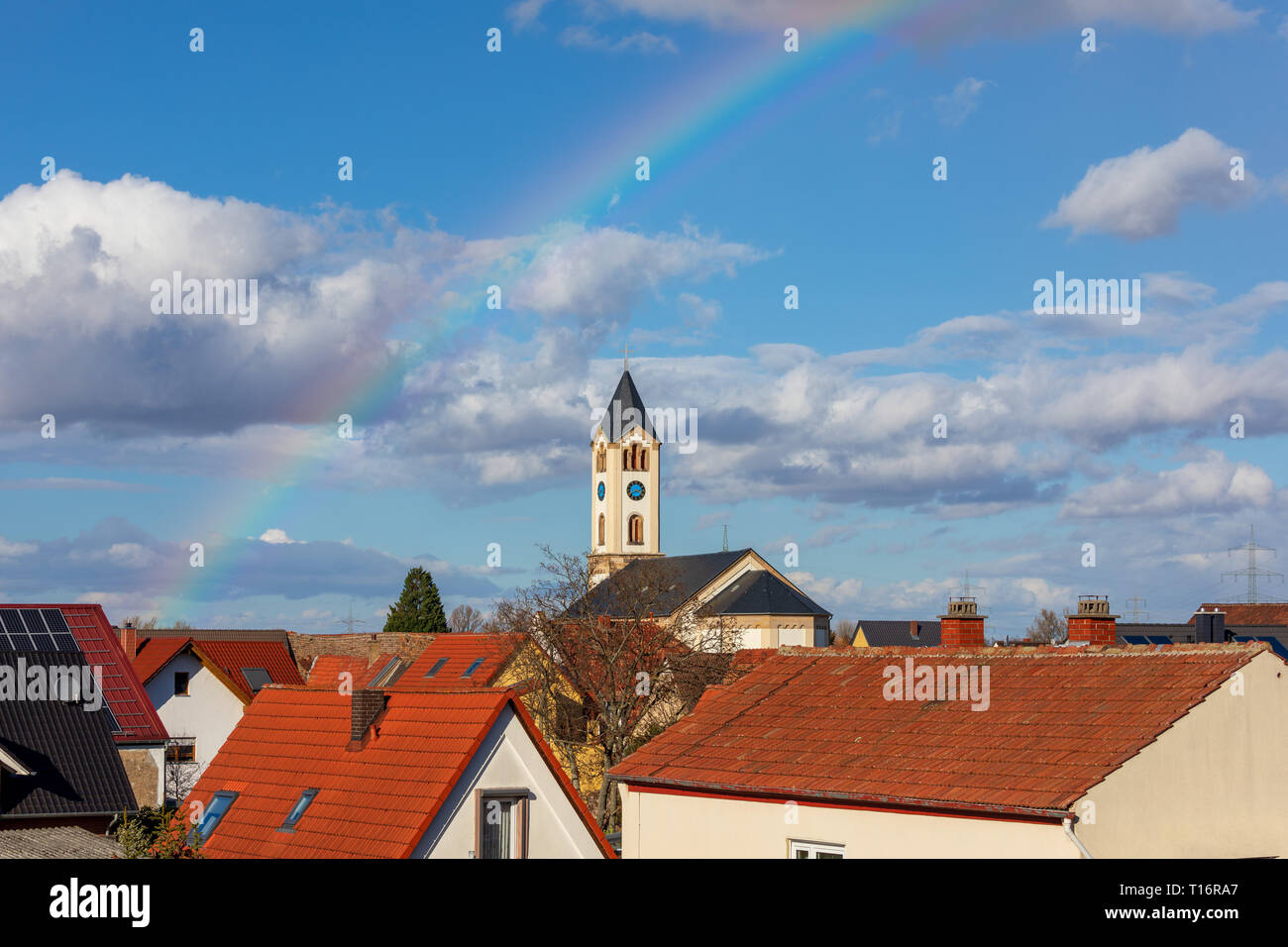 Christian Church in background of rainbow in Frankenthal Germany Stock ...