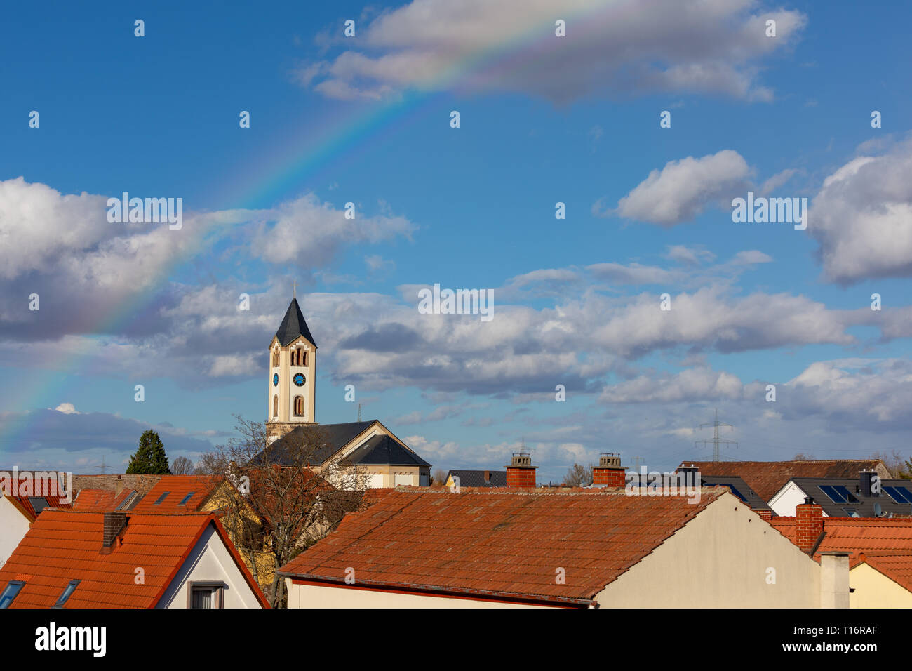 Christian Church in background of rainbow in Frankenthal Germany Stock ...