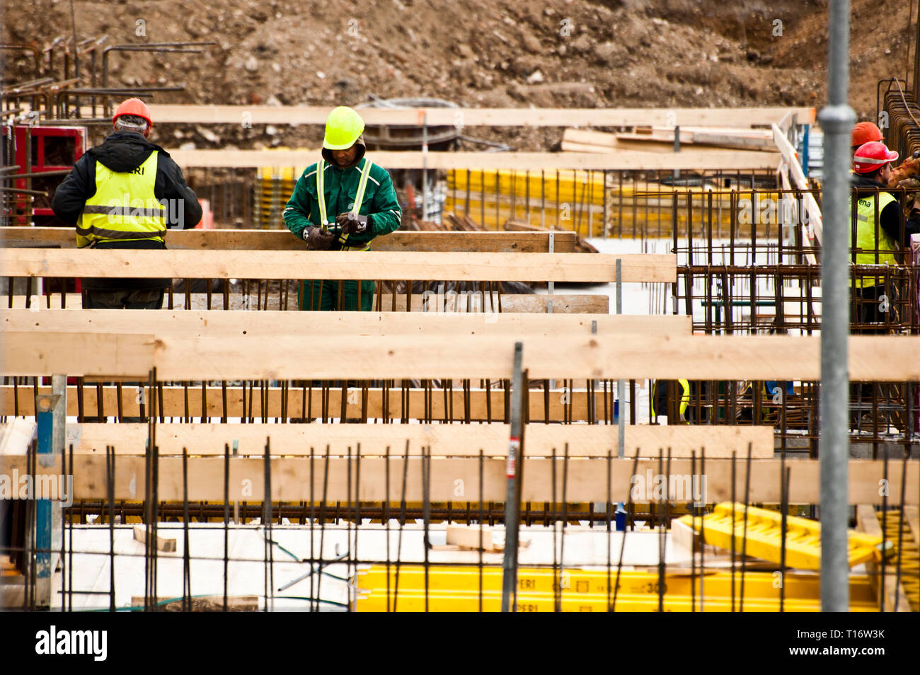 construction workers working on a new building Stock Photo - Alamy