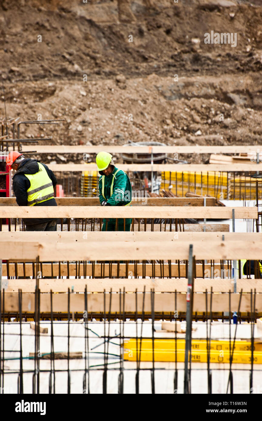 construction workers working on a new building Stock Photo - Alamy