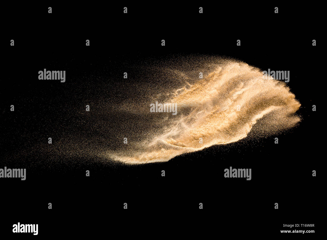 Golden dry river sand explosion isolated on white background. Abstract ...