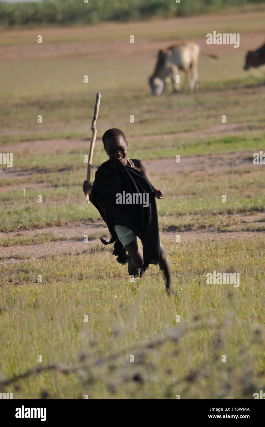 IGUNGA, TANZANIA - 6 FEBRUARY 2012:A child of the Wataturu tribe runs ...