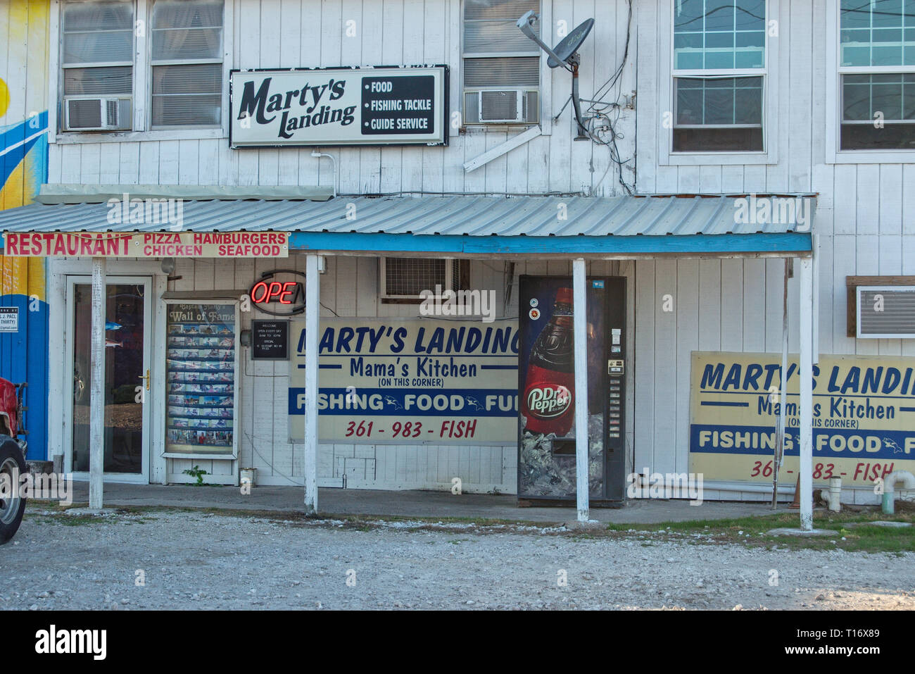 Country store with lots of signs near the shore of the ocean Stock ...
