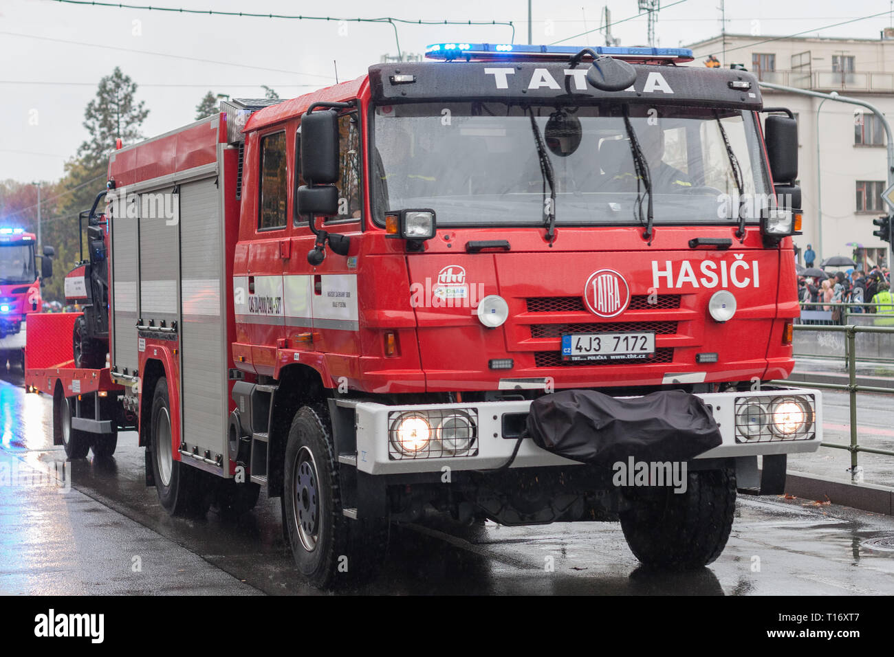 European street, Prague-October 28, 2018: Fire brigade workers are ...