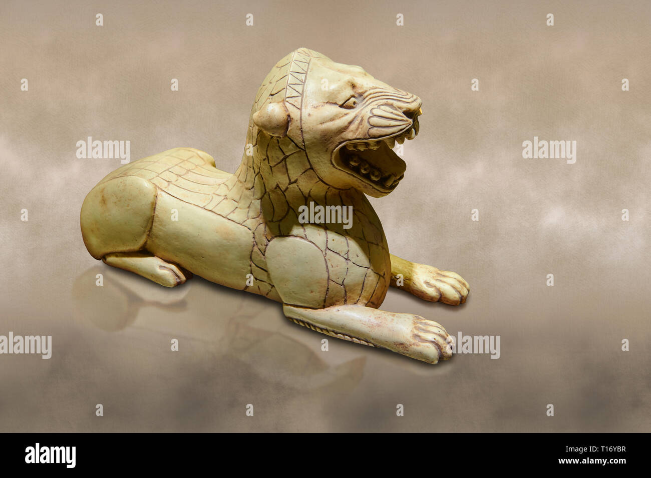 Phrygian ivory statuette carved as a roaring lion lying down from a ...