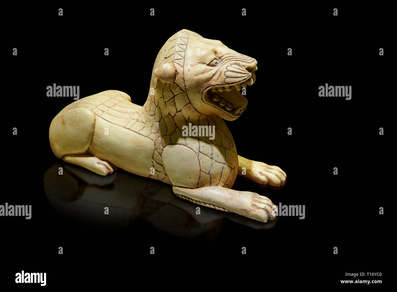 Phrygian ivory statuette carved as a roaring lion lying down from a ...