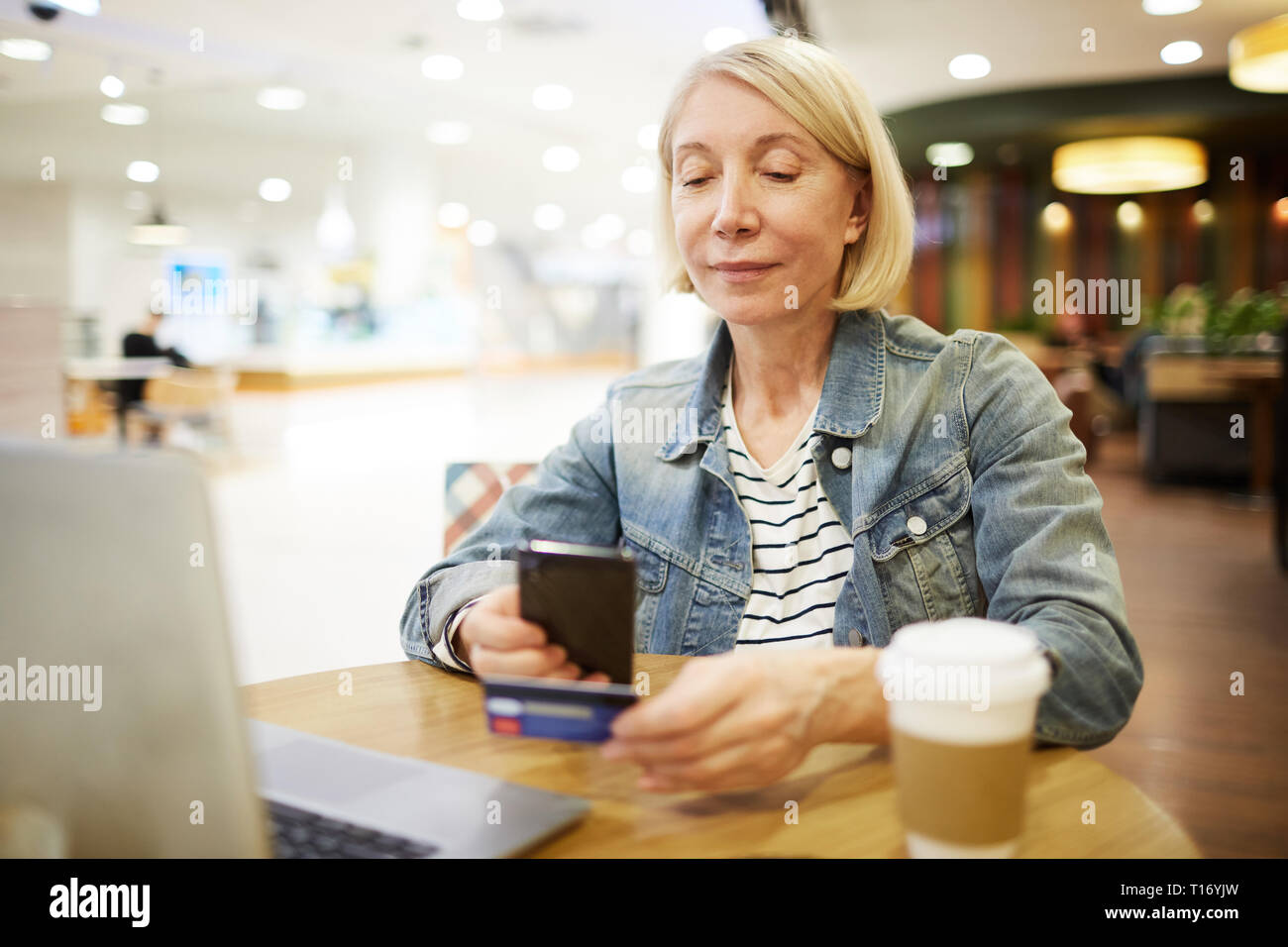 Scanning credit card for online payment Stock Photo - Alamy