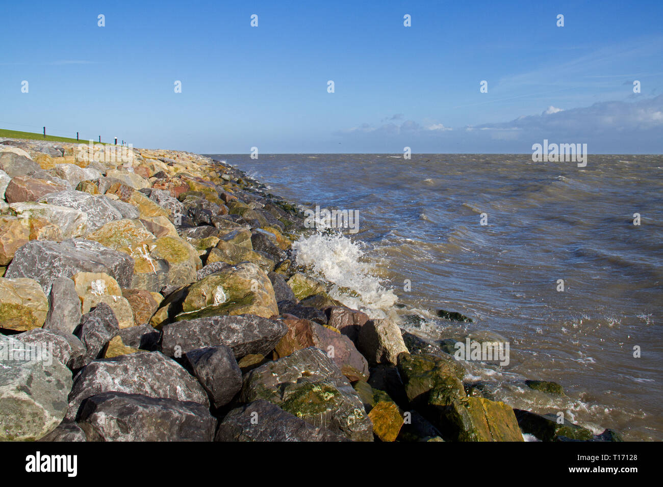 Solid dike in the Netherlands, boulders used for toe protection Stock ...