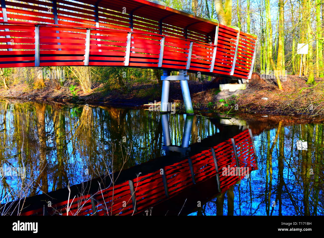 amsterdam - red park bridge & water reflection Stock Photo - Alamy