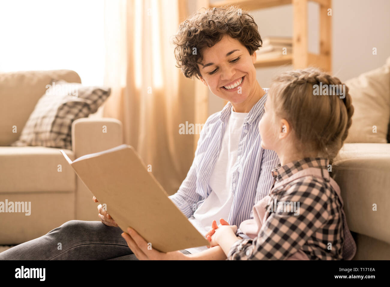 Discussing story from book Stock Photo - Alamy