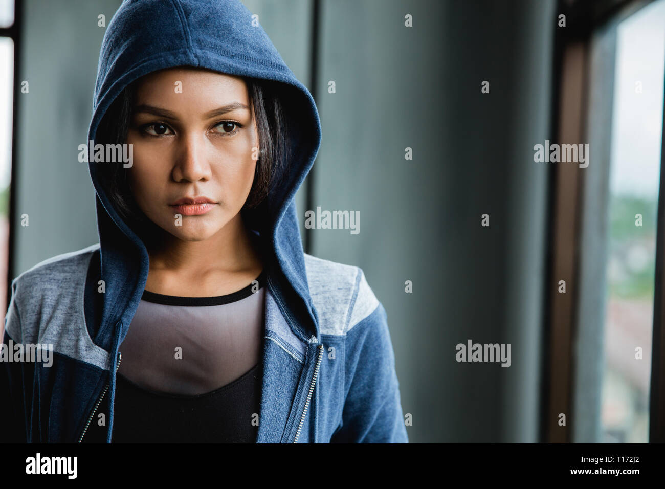 Asian female runner resting hi-res stock photography and images - Alamy