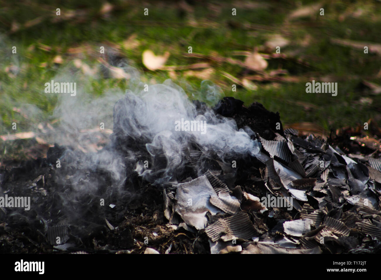 burning wrost paper and smoke Stock Photo - Alamy