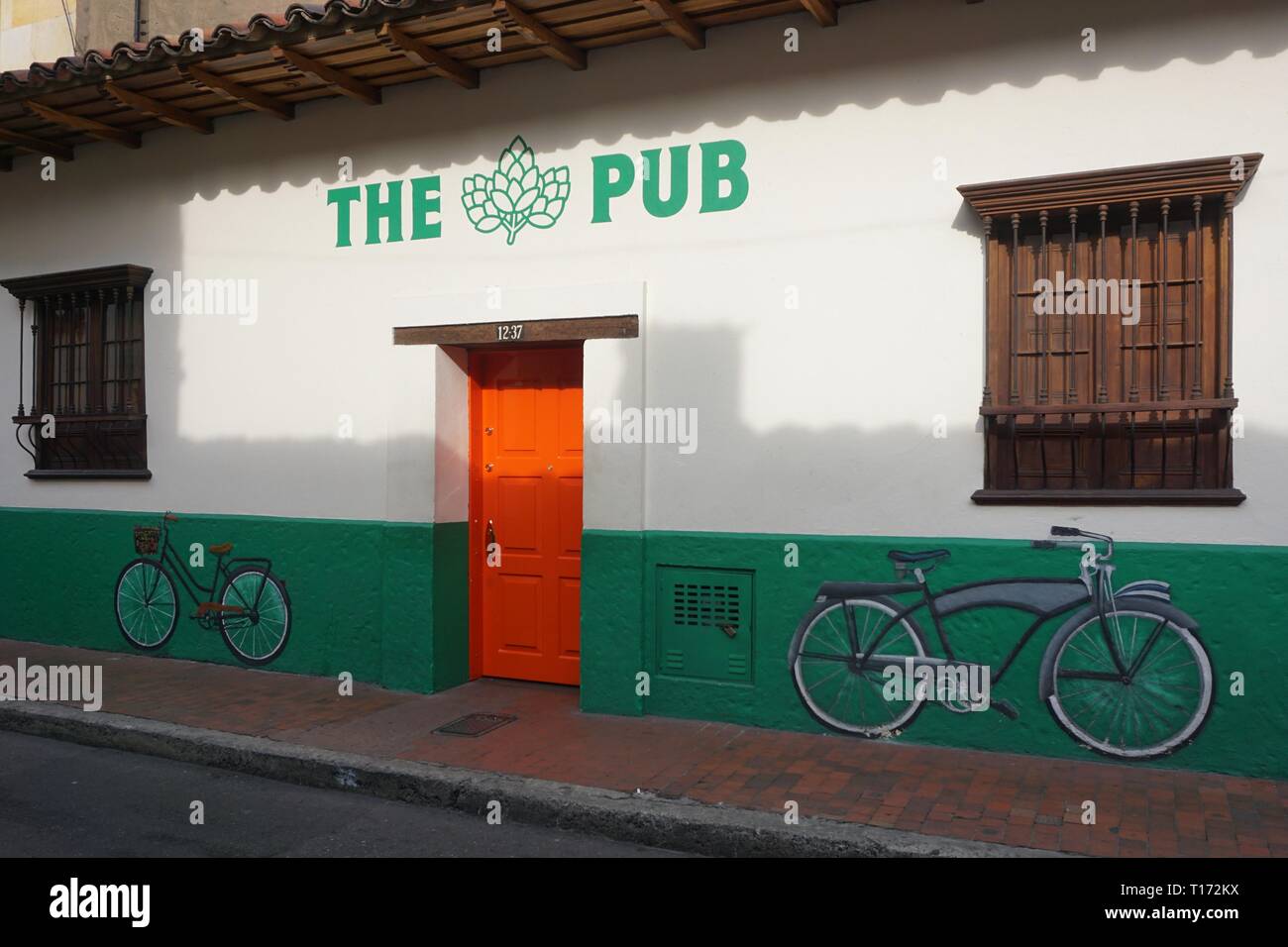 Exterior of a Pub with Bicycles painted on its Walls in Bogota’s La ...