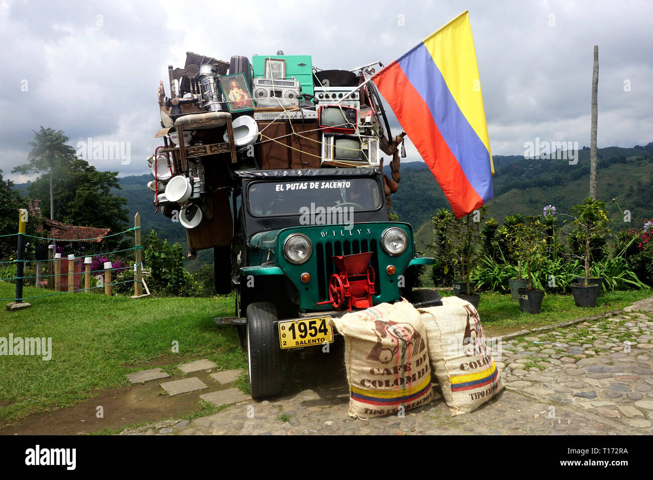 Display of a Willy Jeep overloaded with Household Goods and Flying the ...