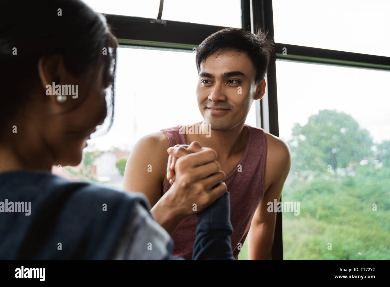 gesture of sport shake hand in the gym Stock Photo - Alamy