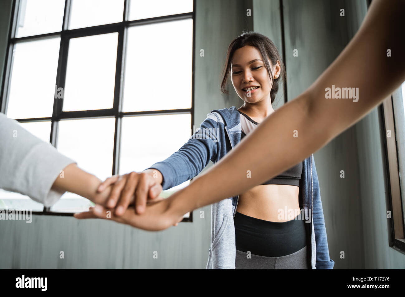 gesture of sport shake hand in the gym Stock Photo - Alamy