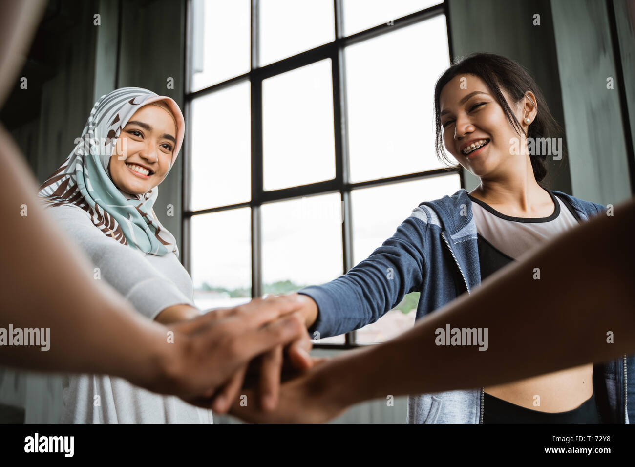 gesture of sport shake hand in the gym Stock Photo - Alamy
