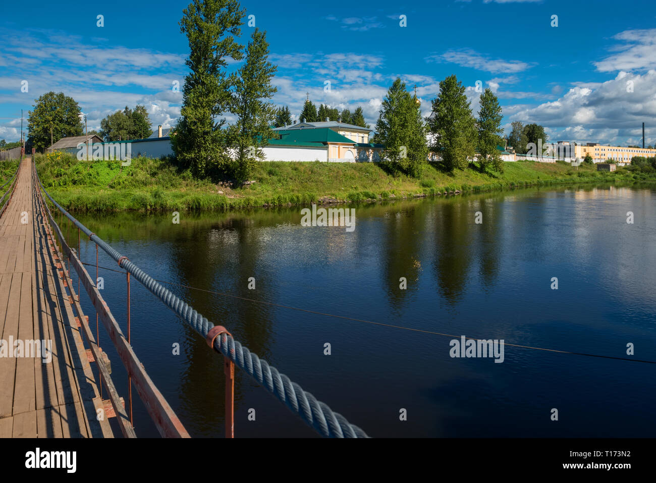 Suspension bridge over the river Msta on a summer day. City Borovichi ...